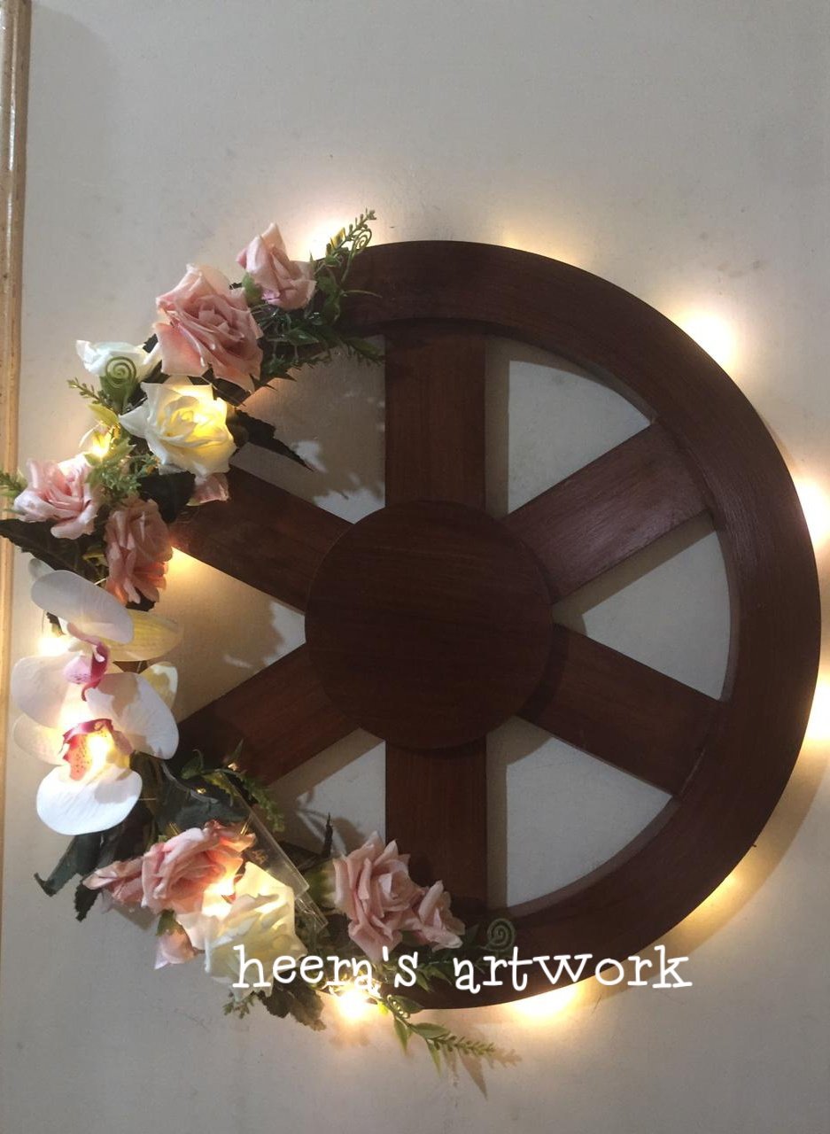 artificial flowers arrangement on wheel - BookFriend Online Store